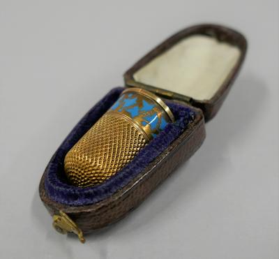 Gold & blue enamel thimble in leather case - Dunedin Public Art Gallery